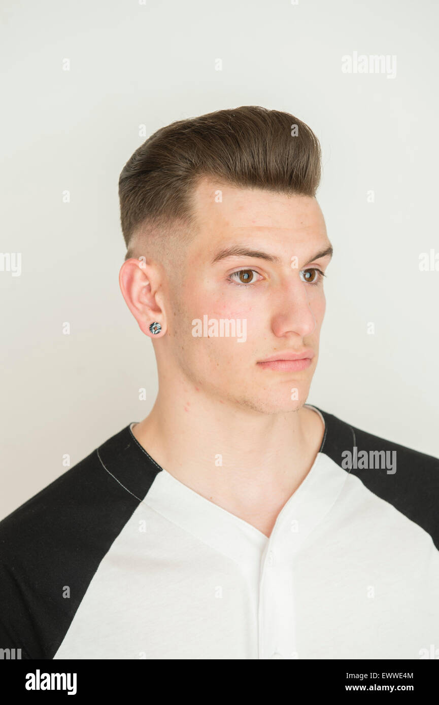 A head and shoulders portrait of a young man male person with a radical ...