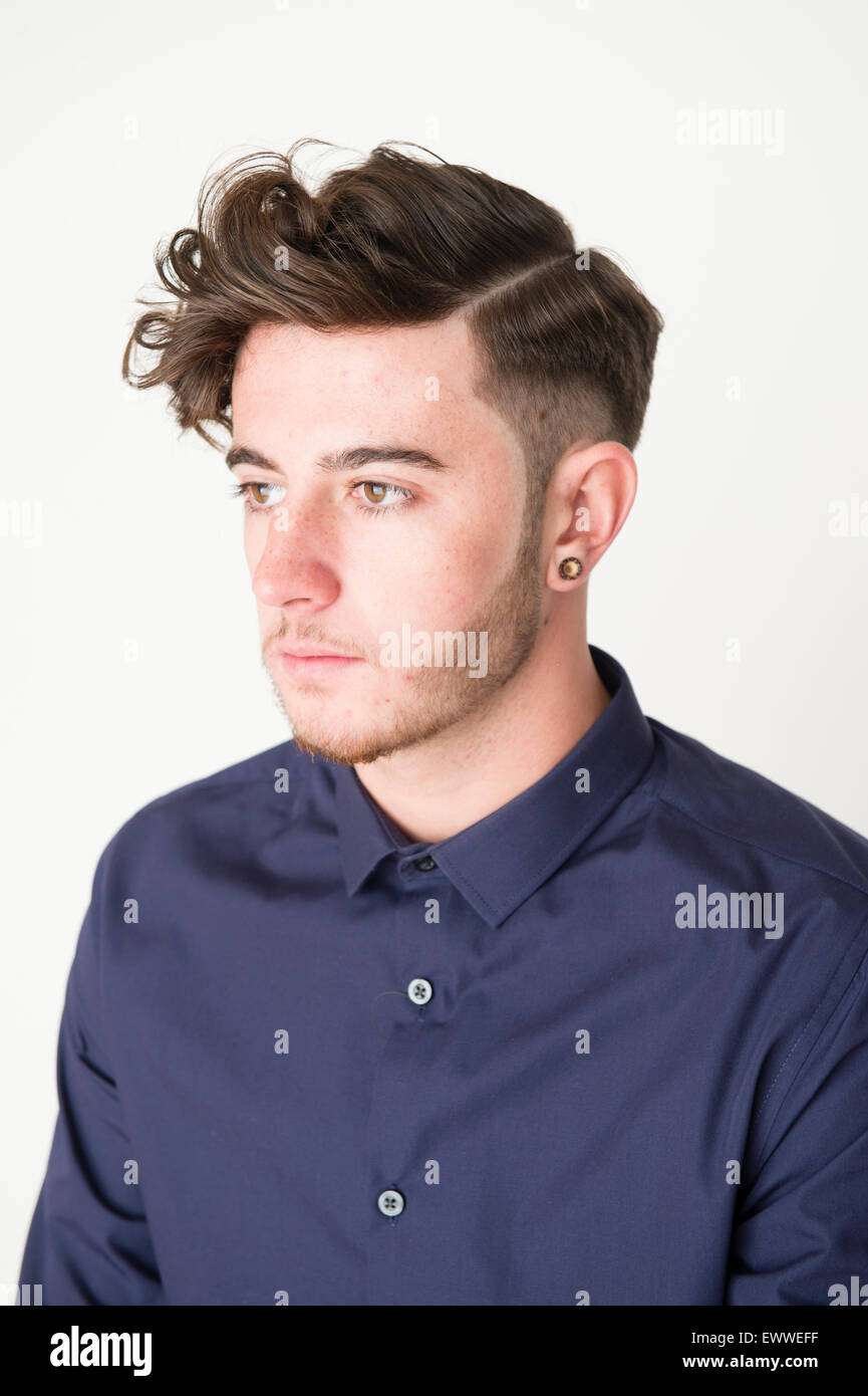 A head and shoulders portrait of a young man male person with a radical ...