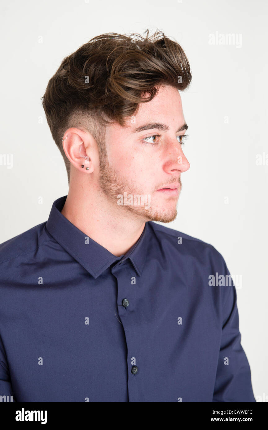 A head and shoulders portrait of a young man male person with a radical ...