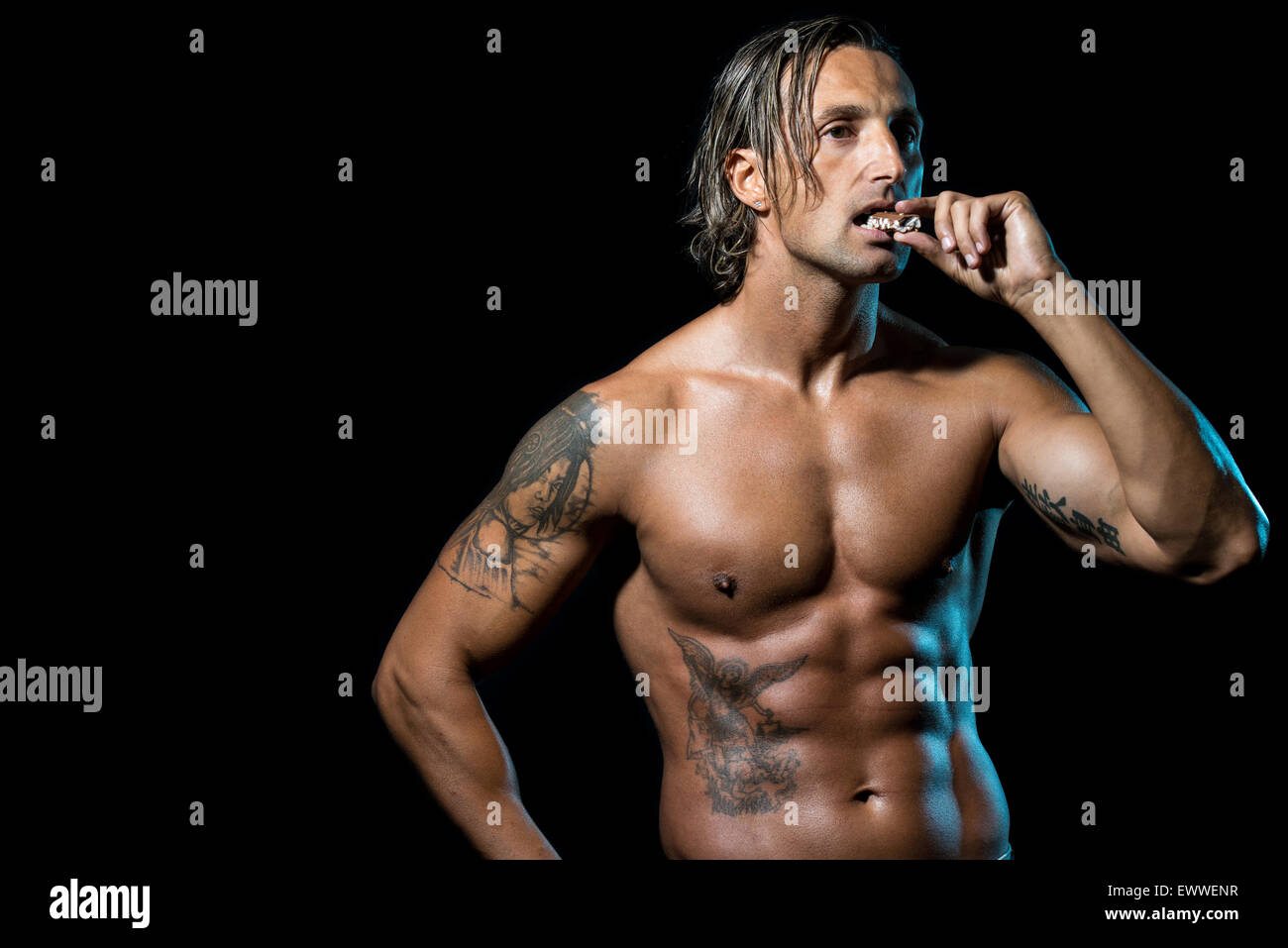 Bodybuilder Eating Chocolate Stock Photo - Alamy