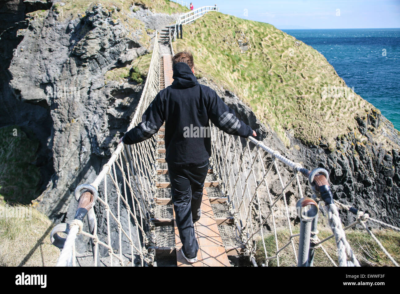 Crossing Carrick a Rede rope bridge, a suspension bridge which spans 20 ...