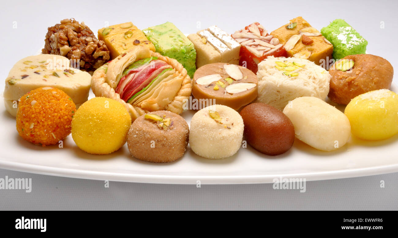 Mix Mithai & Mix Halva in White Dish Stock Photo - Alamy