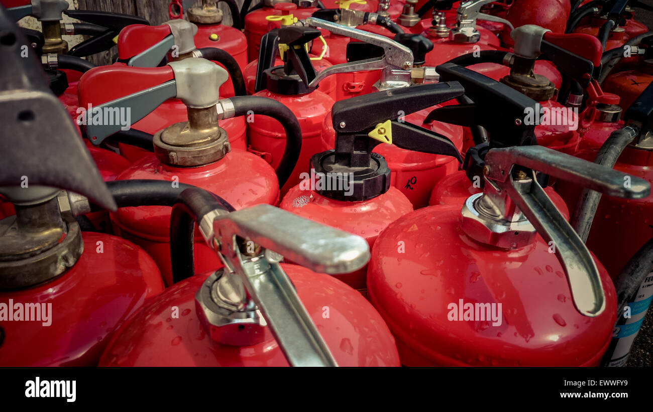 Lot used fire extinguishers as background, close up Stock Photo - Alamy