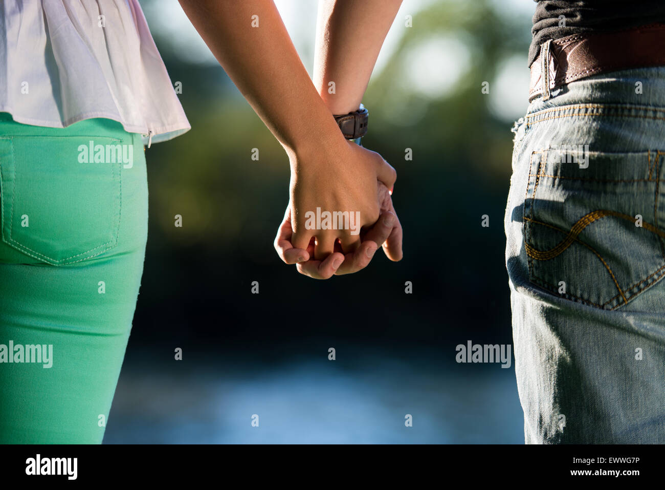 Two clasped hands holding hi-res stock photography and images - Alamy