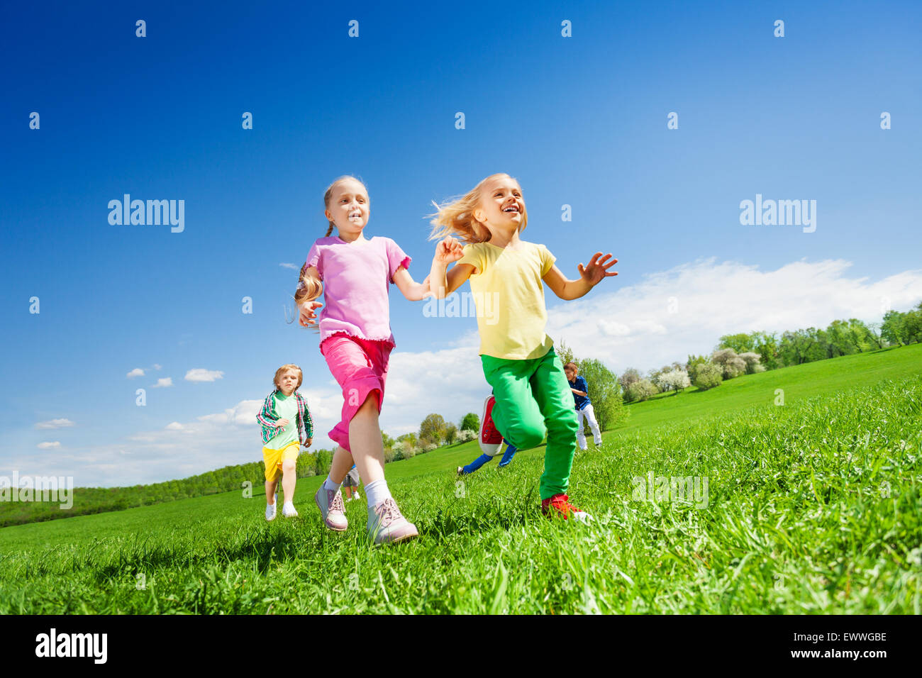 Kids running in field and sports hi-res stock photography and images ...