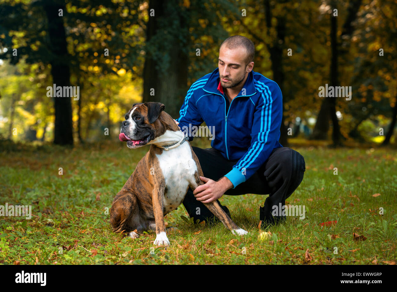 Young Man With Dog Stock Photo - Alamy