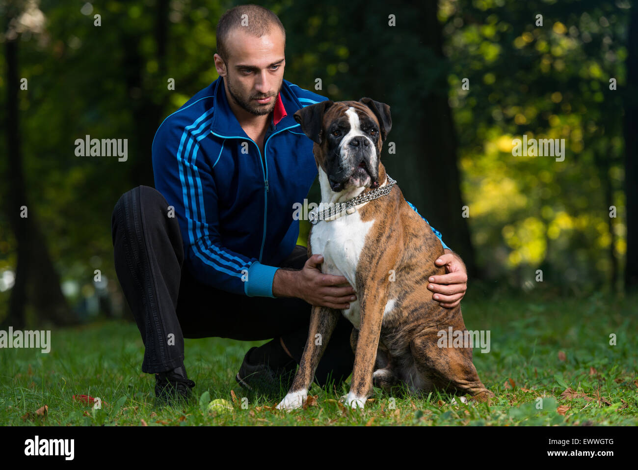 Young Man With Dog Stock Photo - Alamy