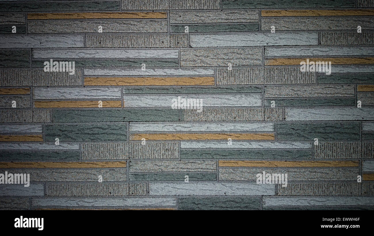 Old wall made of colored resin stone slabs, background Stock Photo - Alamy