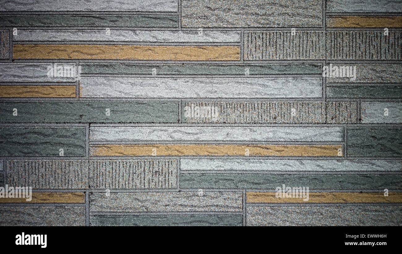 Old wall made of colored resin stone slabs, background Stock Photo - Alamy