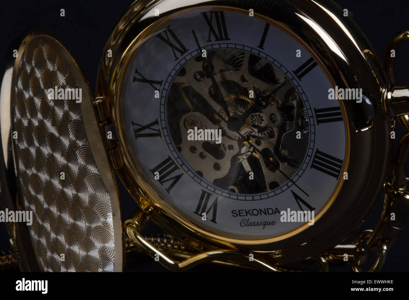 A close up of the inside of a beautiful Golden Pocket Watch, showing us ...