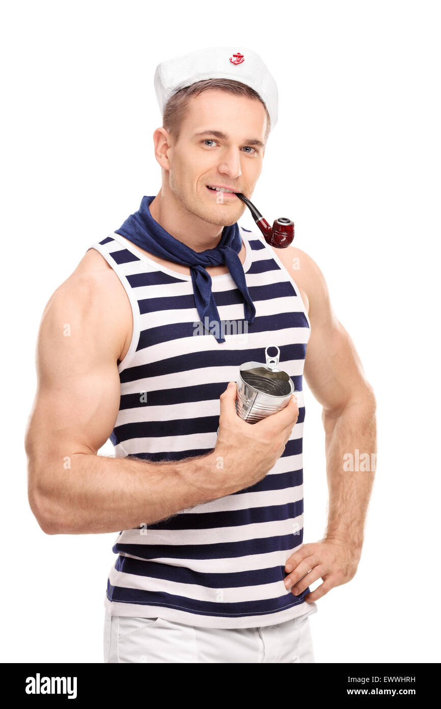 Vertical shot of a male sailor smoking a pipe and holding a food can ...