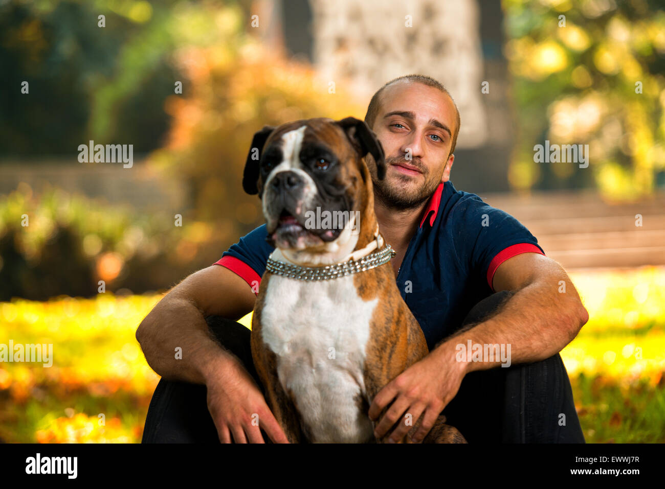 Man Holding Dog Stock Photo - Alamy