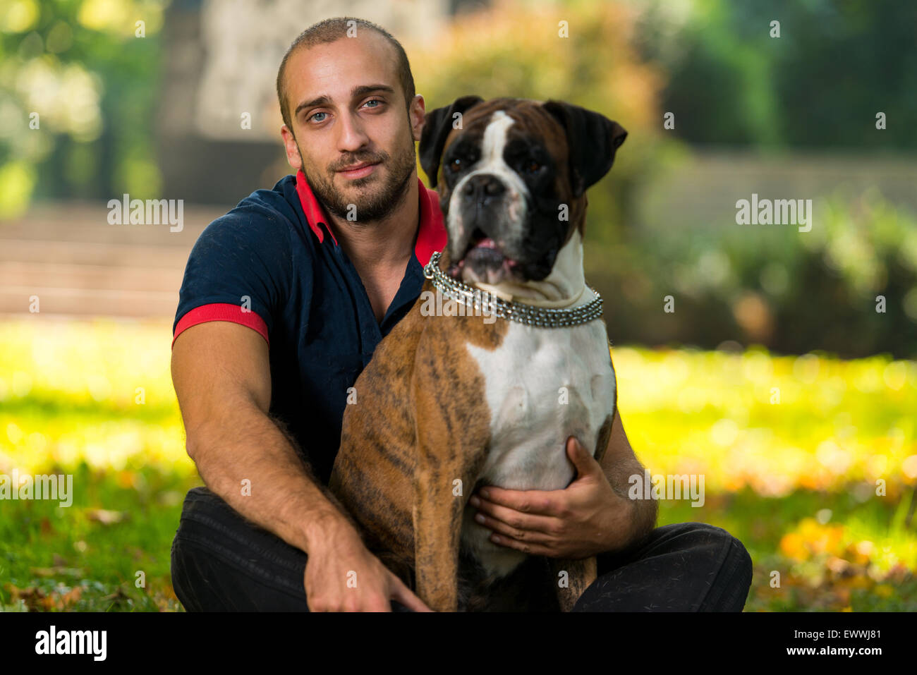 Young Man With Dog Stock Photo - Alamy