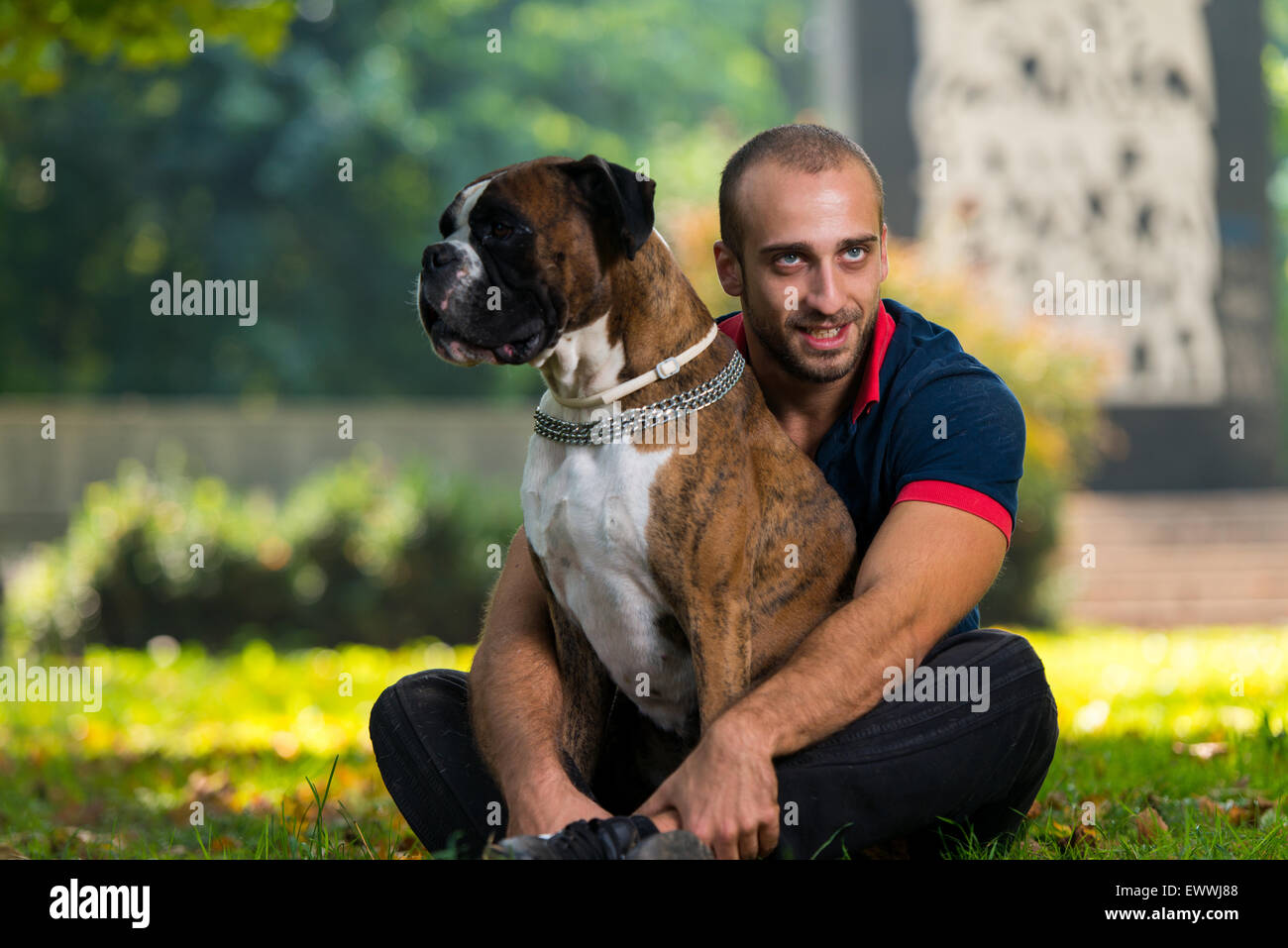 Man And His German Boxer Stock Photo - Alamy