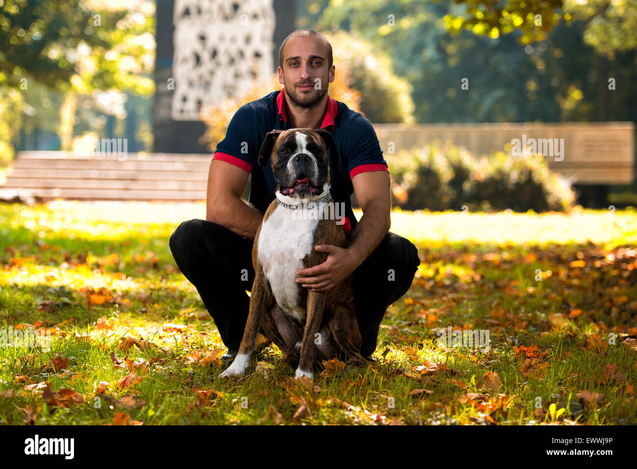 Man Holding Dog Stock Photo - Alamy