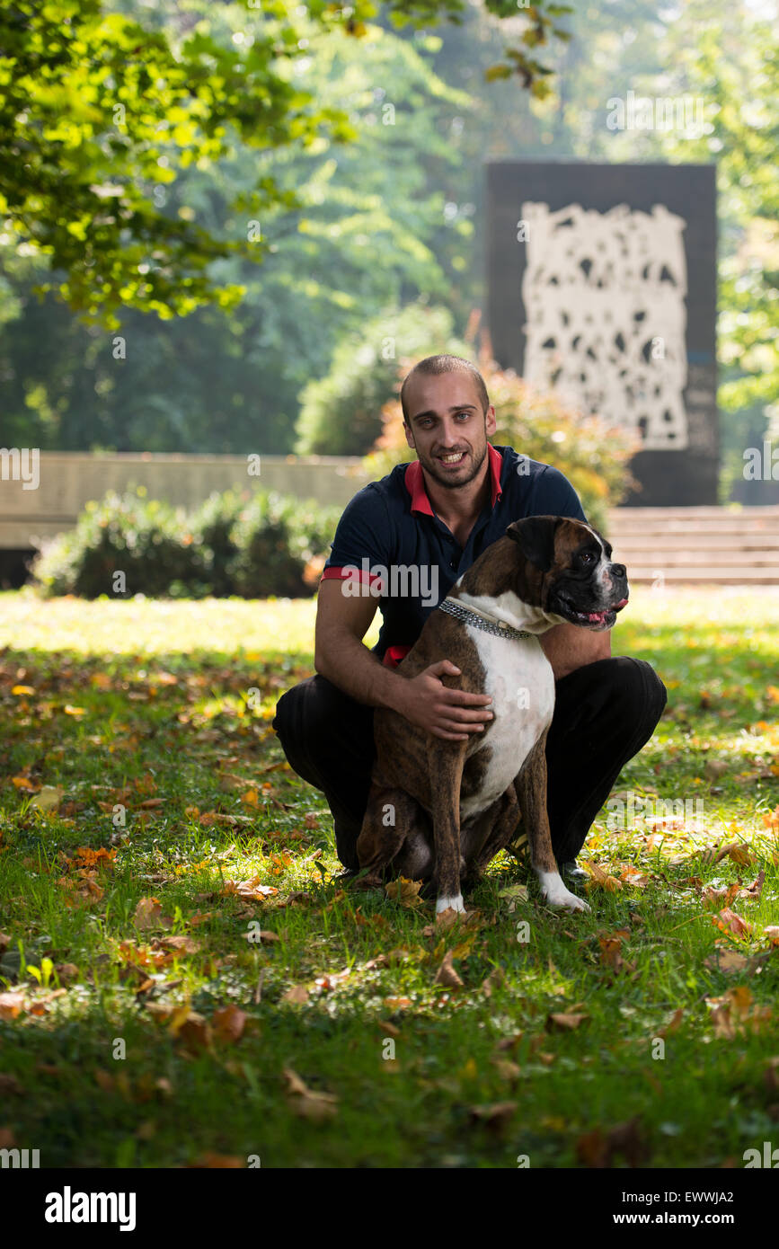 Young Man With Dog Stock Photo - Alamy