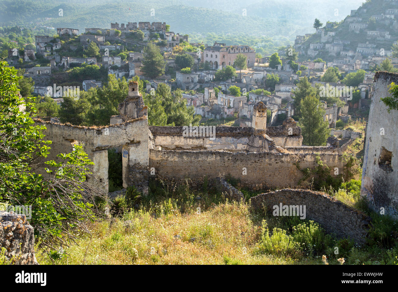 Empty houses at ghost town village Kayakoy ruins near Fethiye in Turkey ...