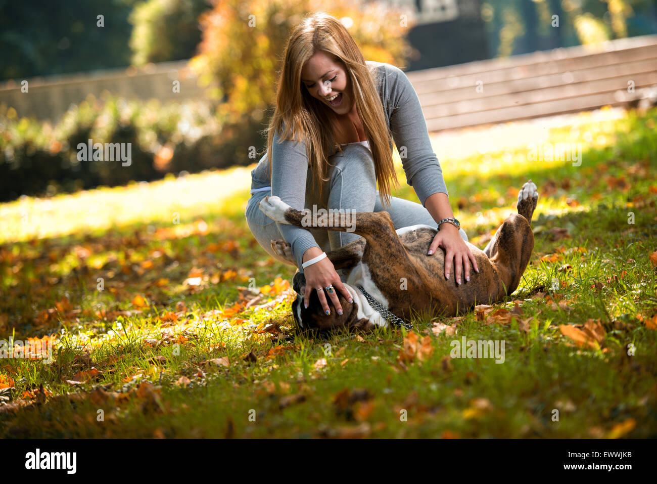 Women Holding Dog Stock Photo - Alamy