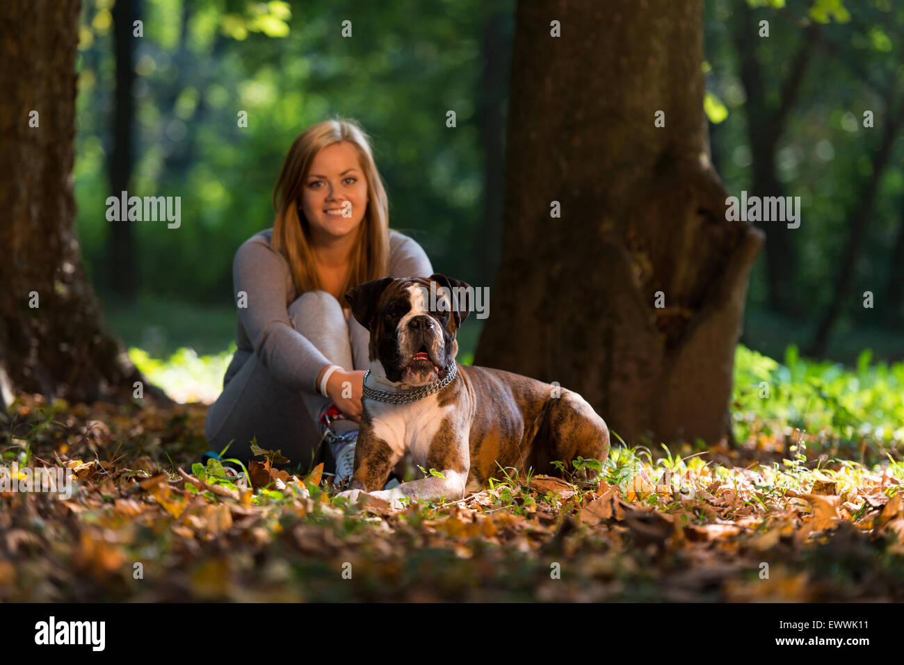 Women Holding Dog Stock Photo - Alamy