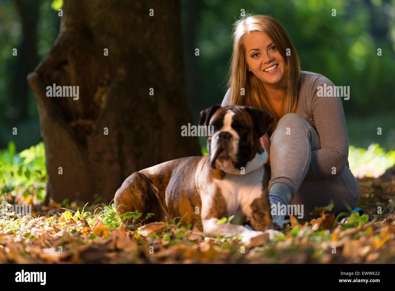 Women Holding Dog Stock Photo - Alamy