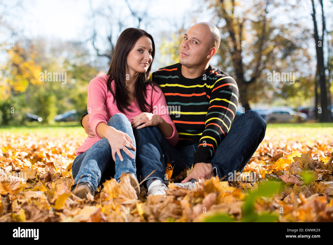 Romantic Couple In A Park Stock Photo - Alamy