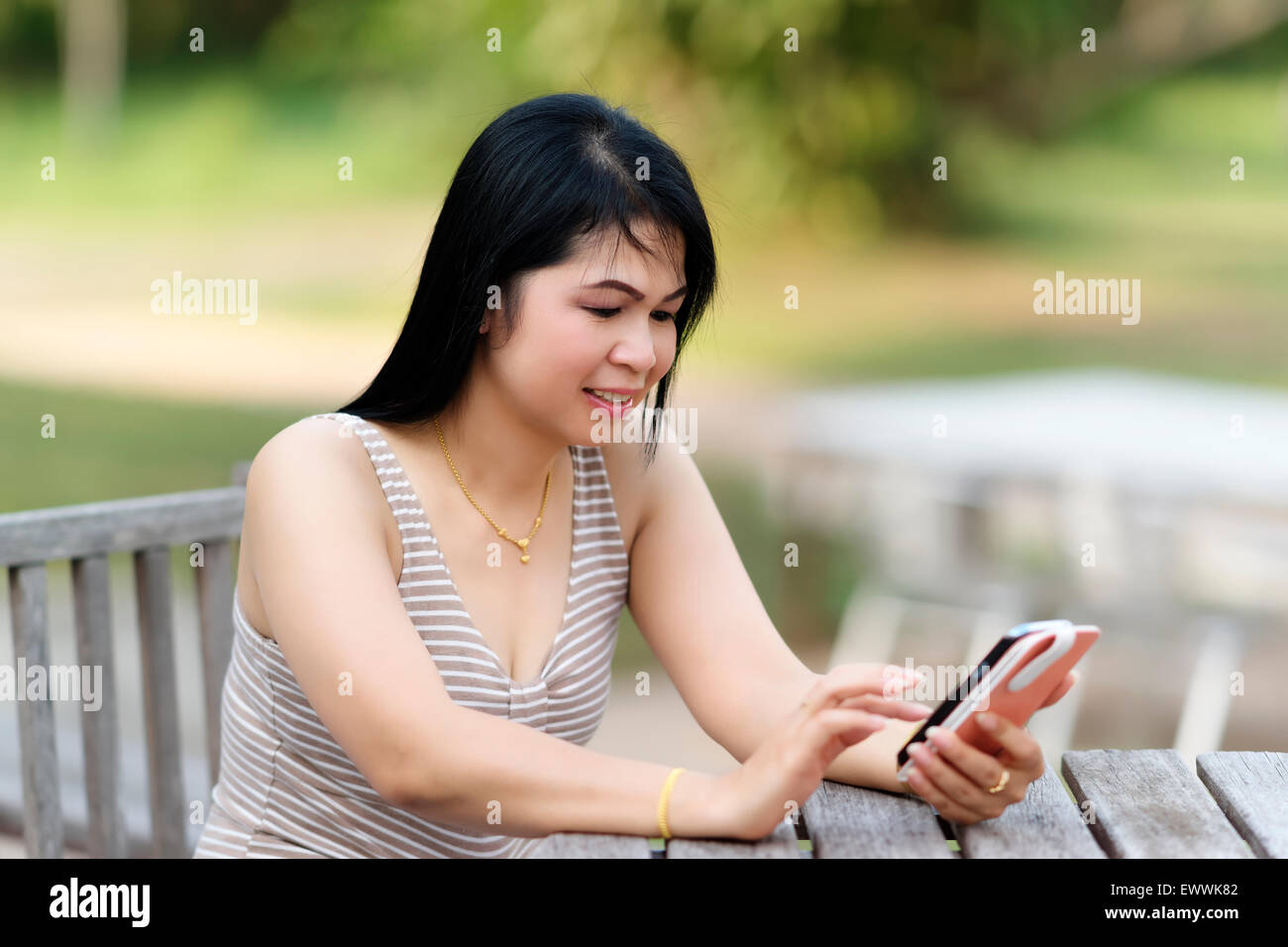 Woman enjoy with smart phone in holiday Stock Photo - Alamy