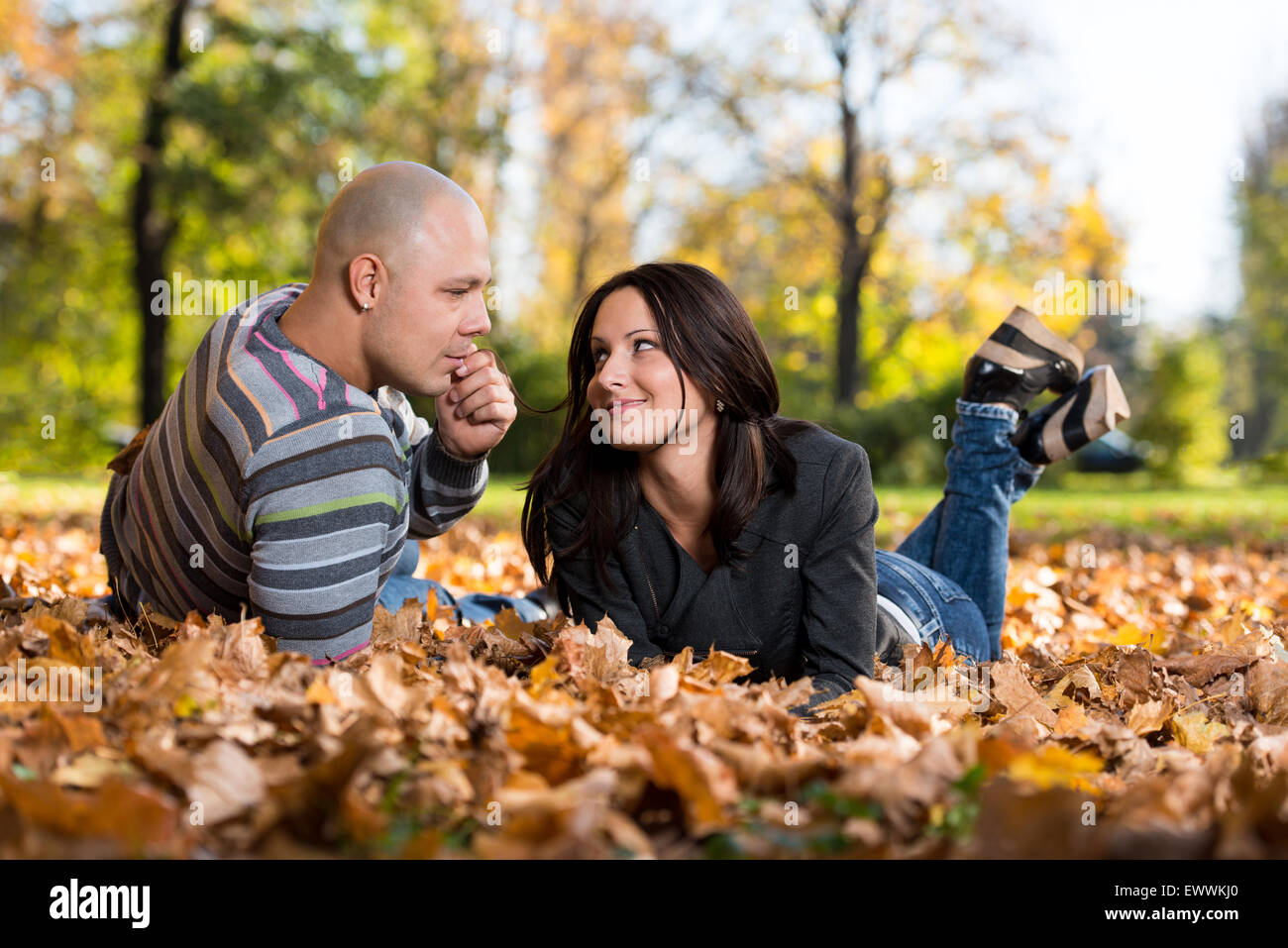 Romantic Couple In A Park Stock Photo - Alamy