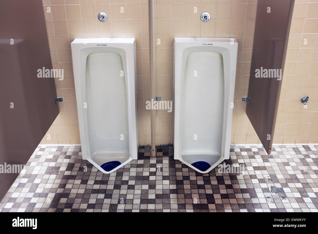 Side by side urinals in a men's restroom Stock Photo - Alamy