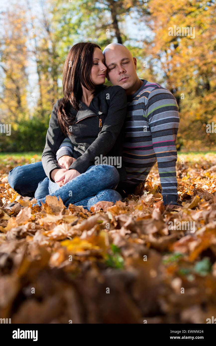 Romantic Couple In A Park Stock Photo - Alamy