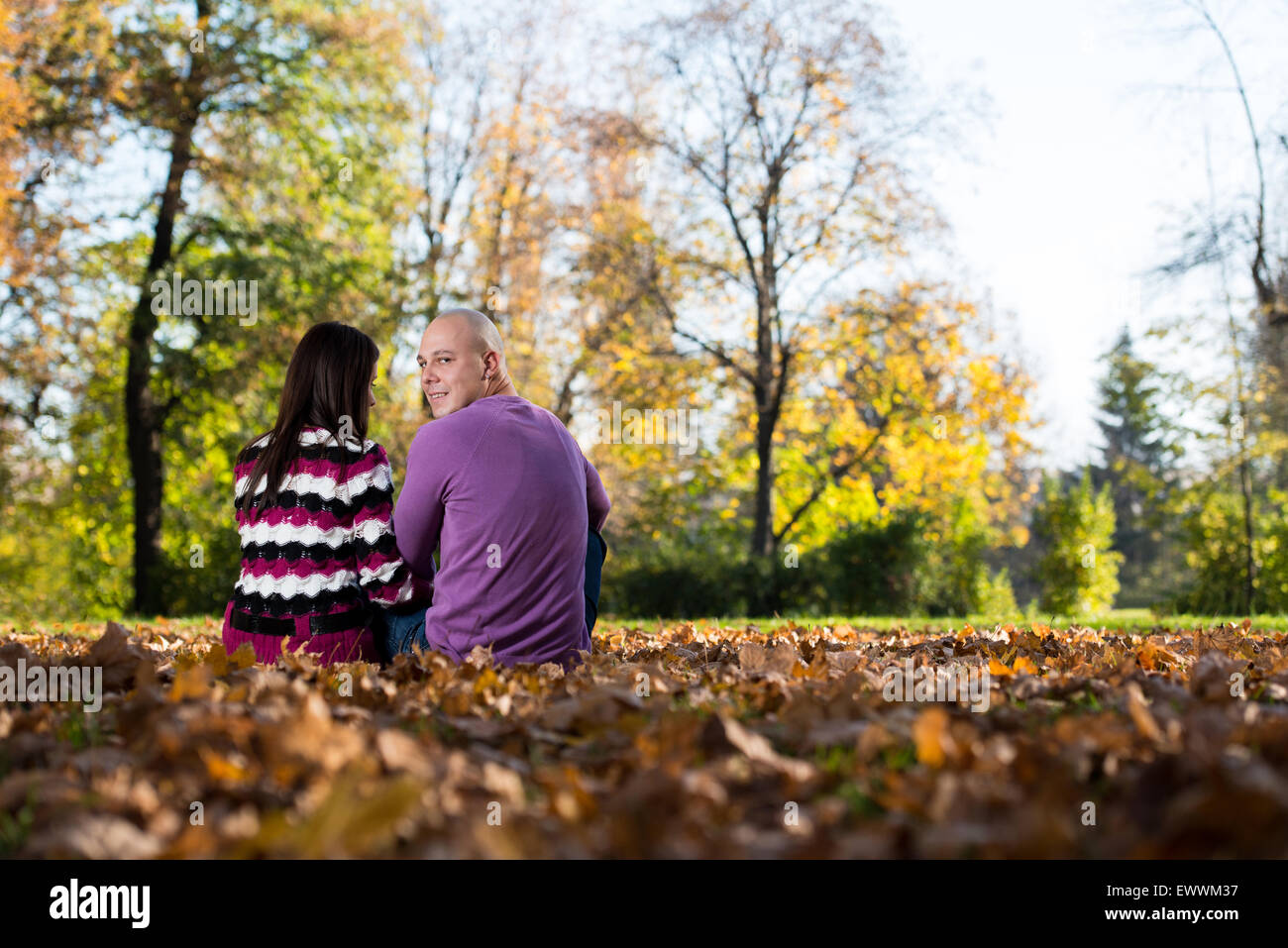 Romantic Couple In A Park Stock Photo - Alamy
