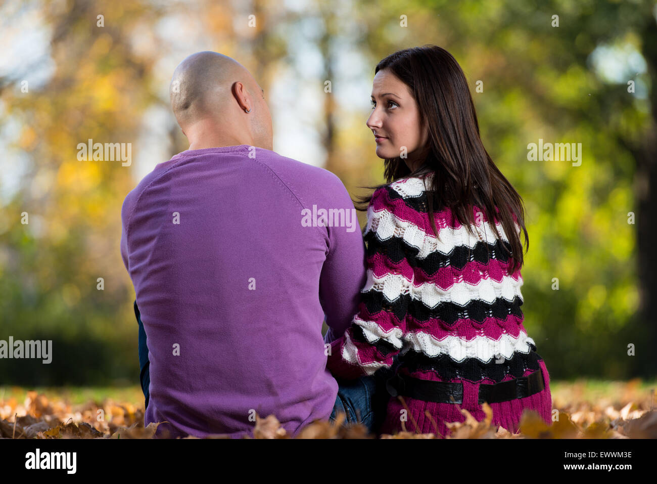 Romantic Couple In A Park Stock Photo - Alamy