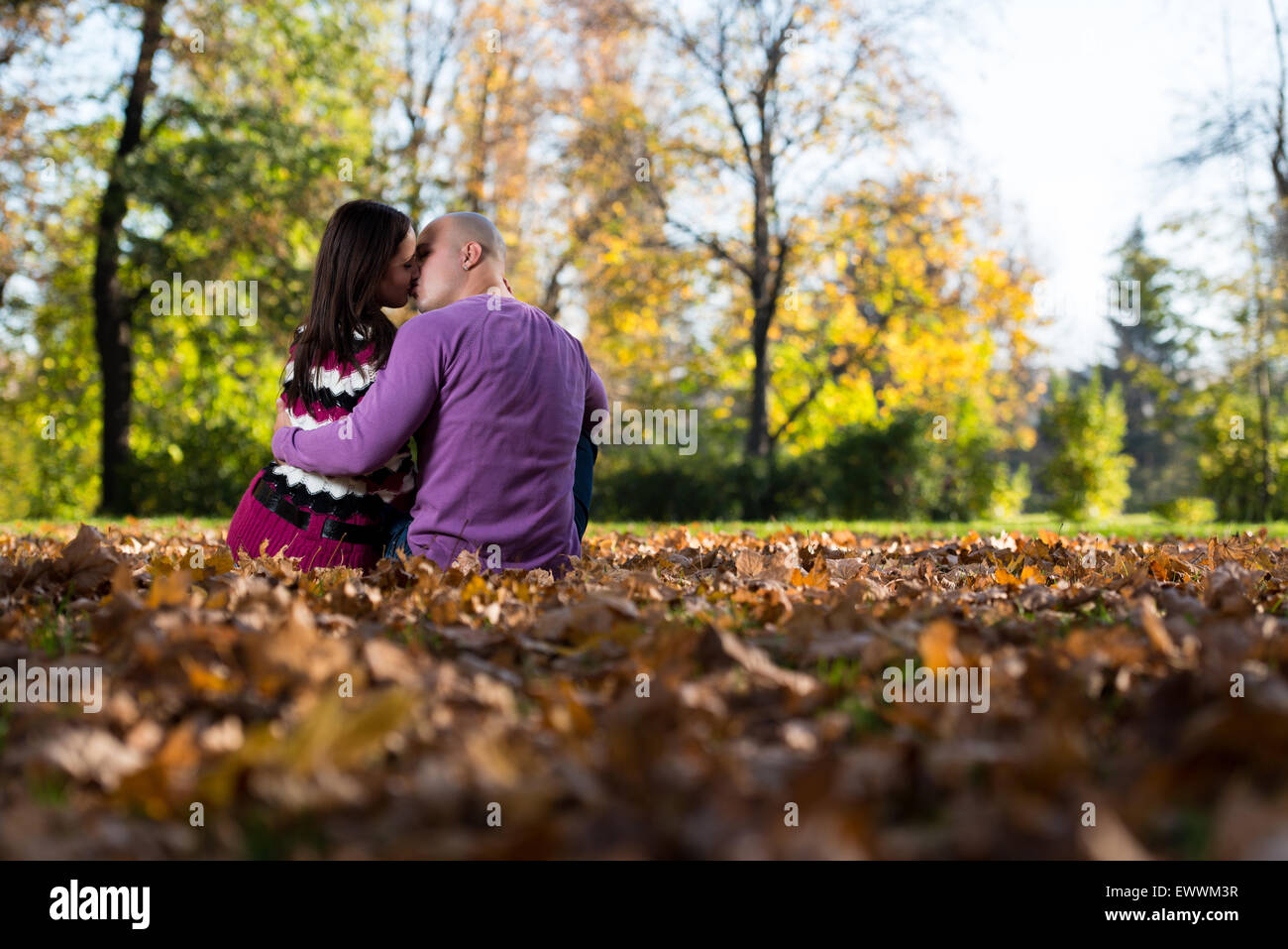 Romantic Couple In A Park Stock Photo - Alamy