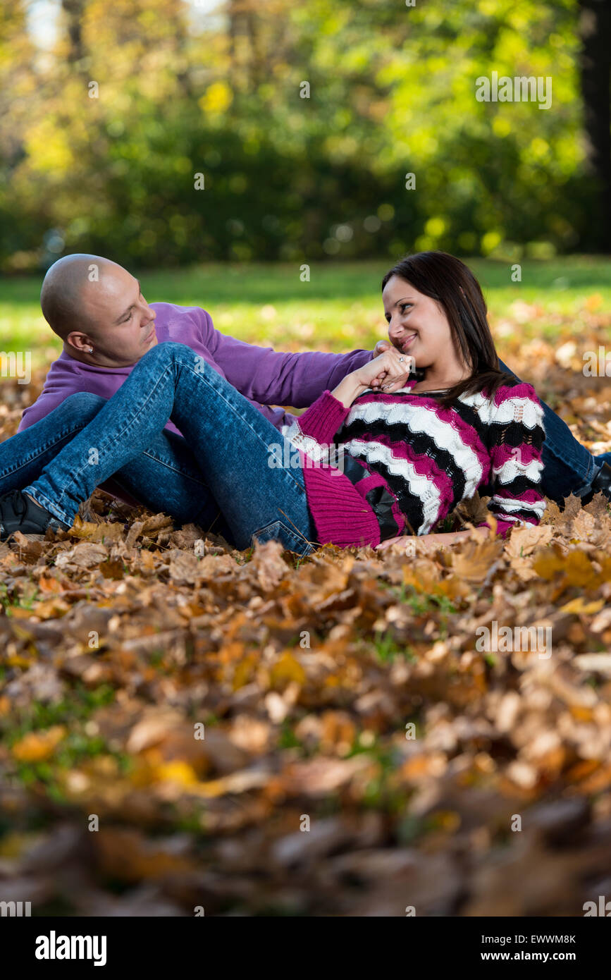 Romantic Couple In A Park Stock Photo - Alamy