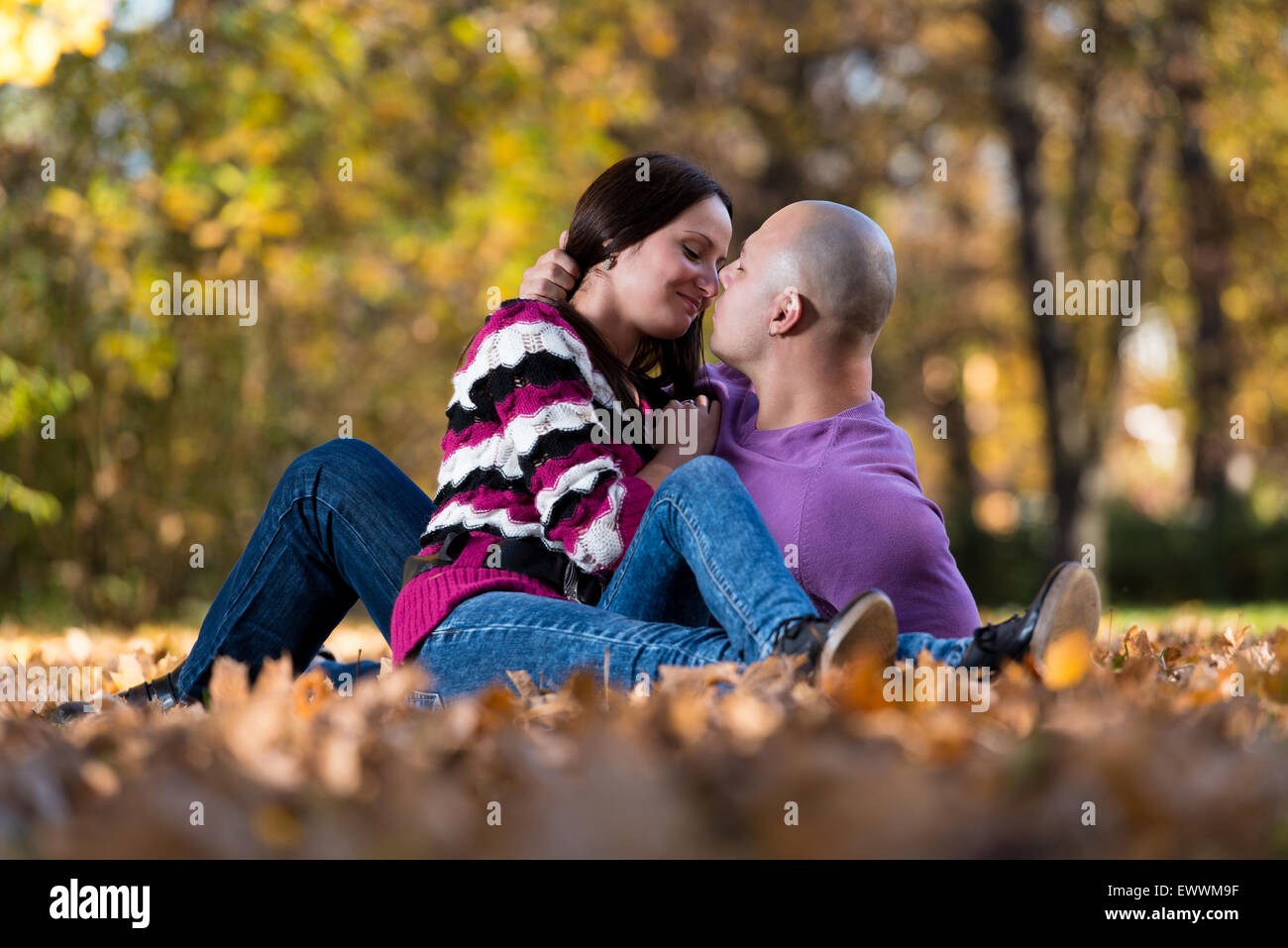 Romantic Couple In A Park Stock Photo - Alamy