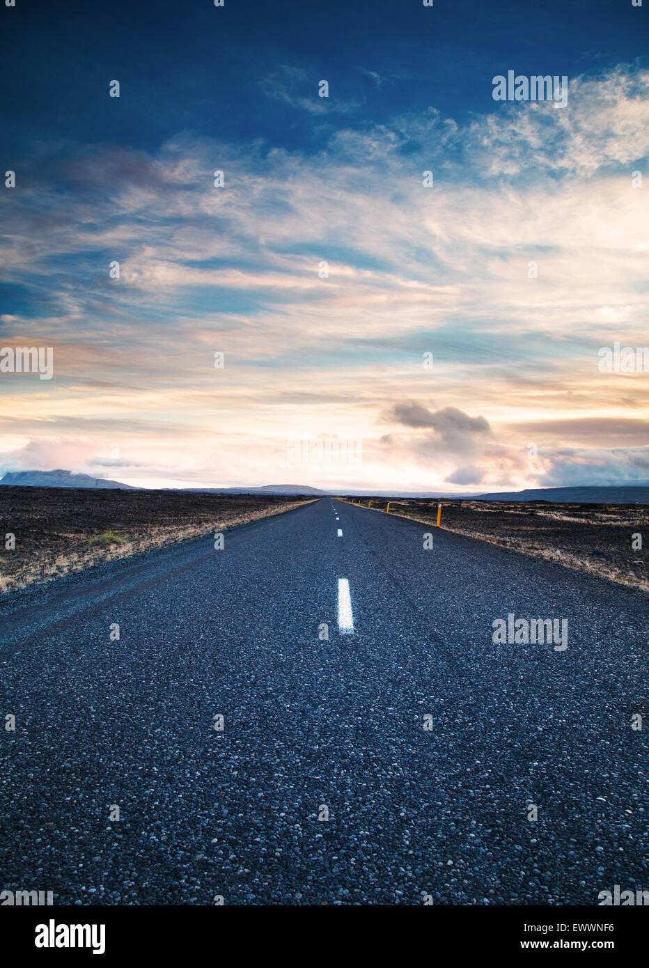 Road leading into the distance under a dramatic sky Stock Photo - Alamy