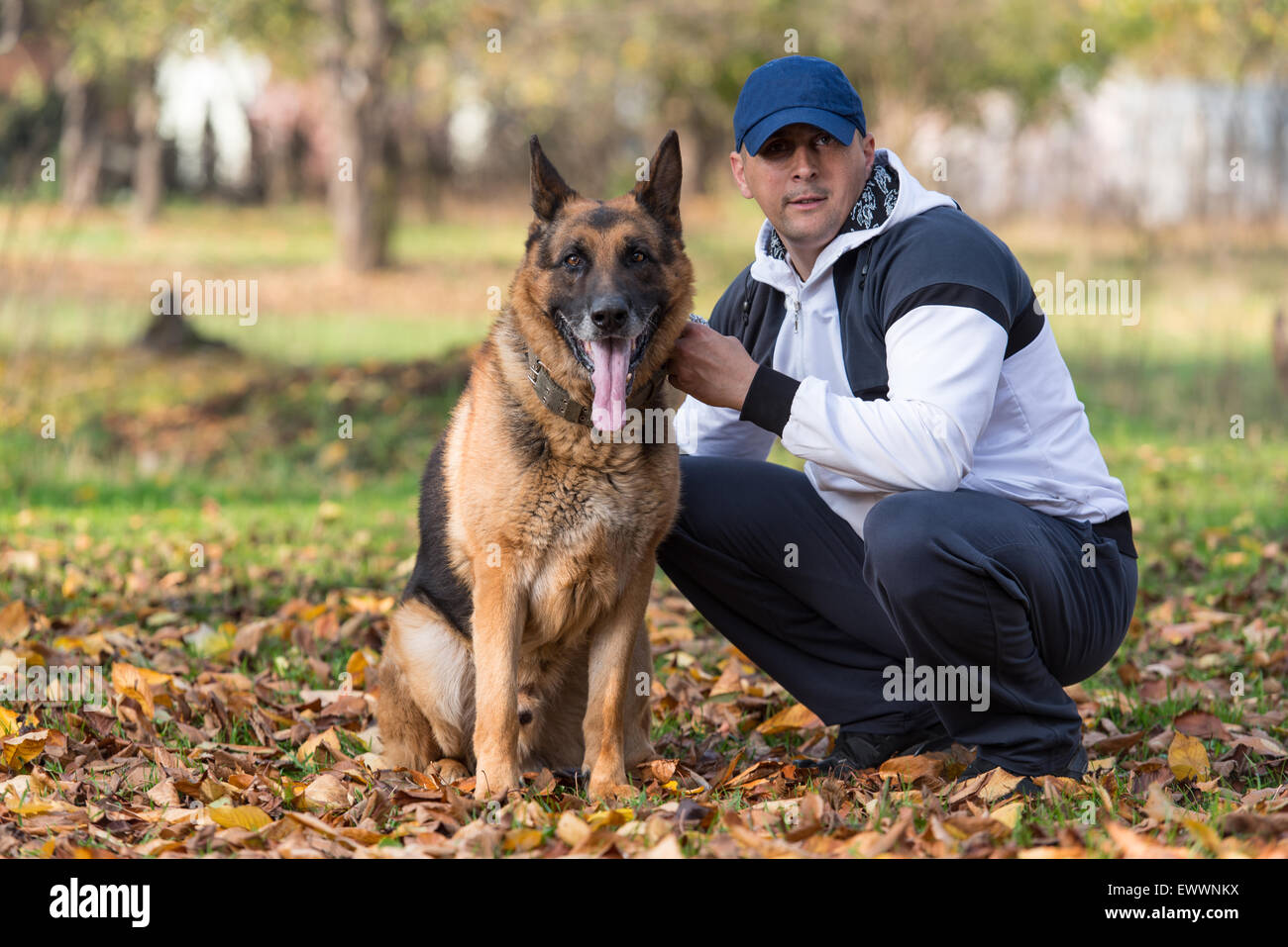Man Holding Dog German Shepherd Stock Photo - Alamy
