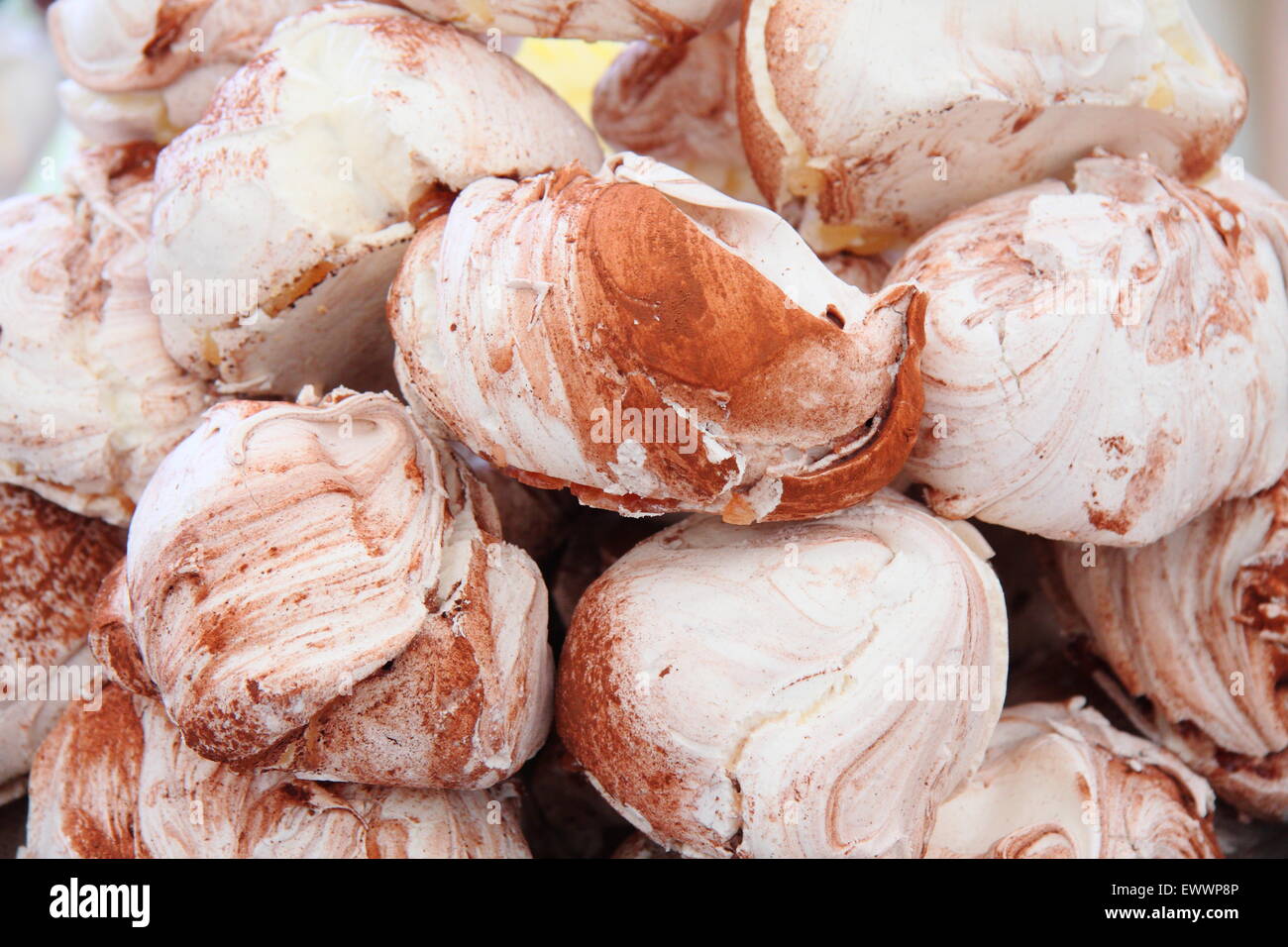 A stack of chocolate meringues are offered for sale at a food stall in ...