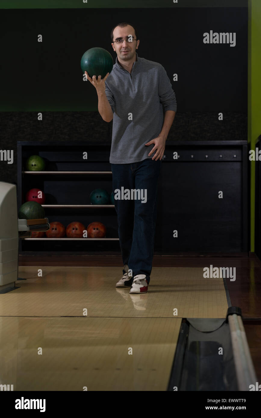Young Man Bowling Stock Photo - Alamy