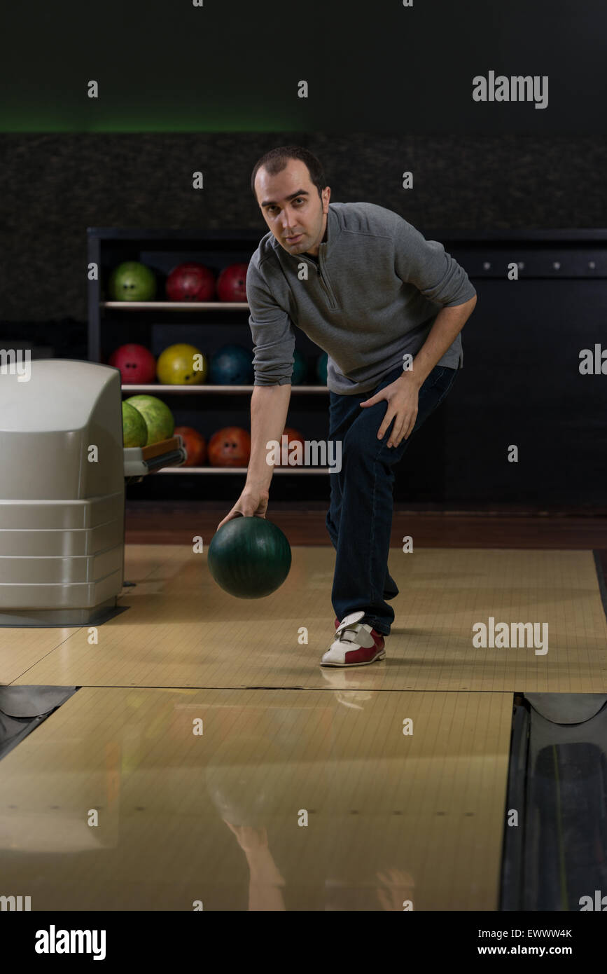 Young Man Bowling Stock Photo - Alamy