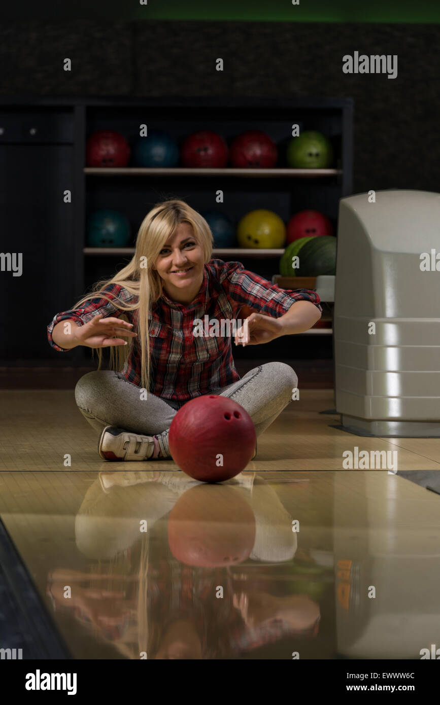 Happy Bowler Sitting At The Bowling Alley Stock Photo - Alamy