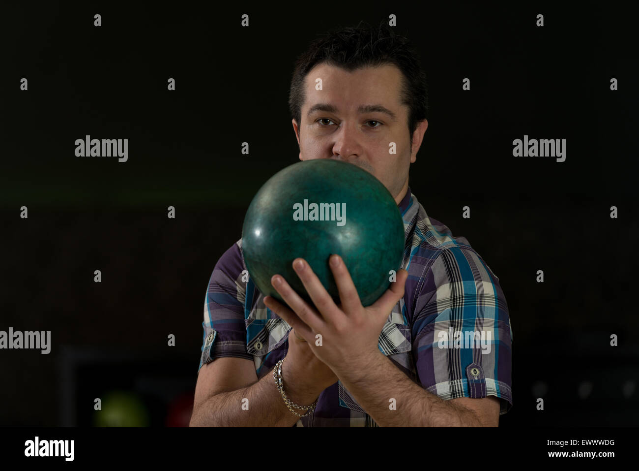 Man Holding A Bowling Ball Stock Photo - Alamy
