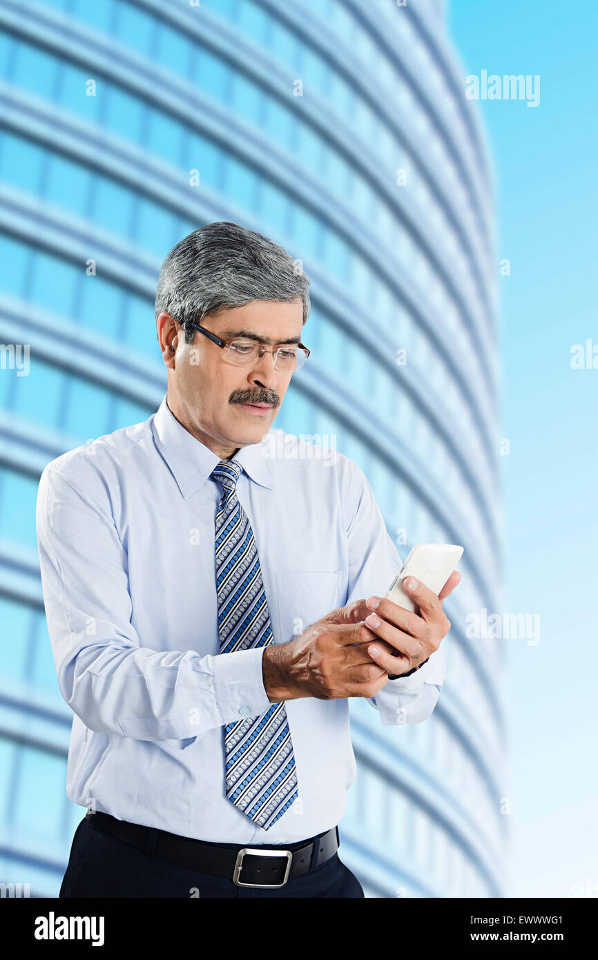 1 indian Business Man dialing Cell Phone Stock Photo - Alamy