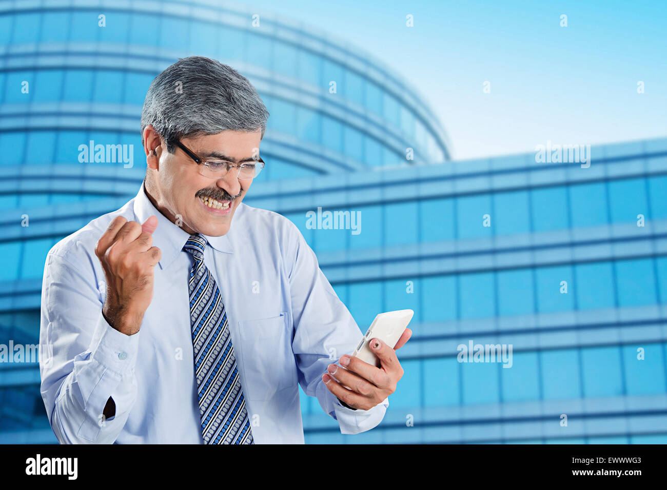 1 indian Business Man dialing Cell Phone Stock Photo - Alamy