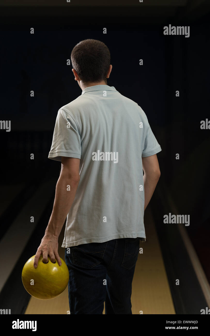 Man Holding A Bowling Ball Stock Photo - Alamy