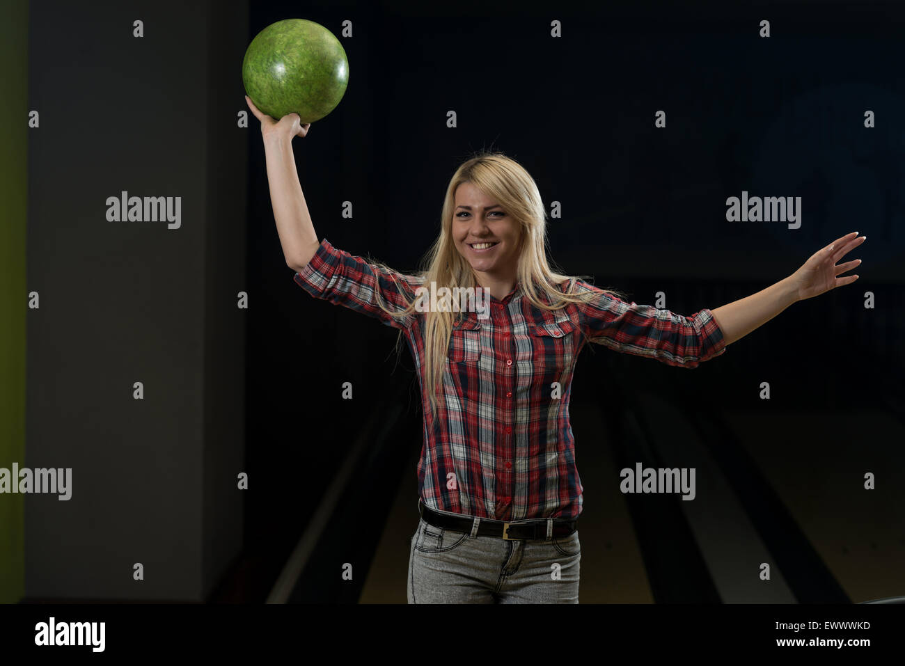 Jumping Women Happy About The Win Stock Photo - Alamy
