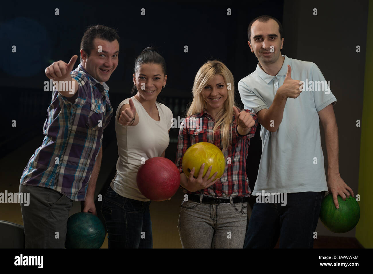 Friends Bowling Together Stock Photo - Alamy
