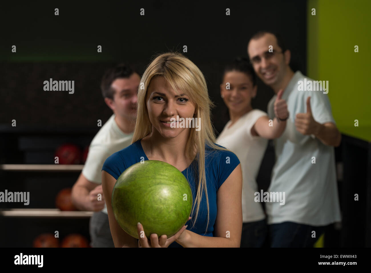 Friends Bowling Together Stock Photo - Alamy