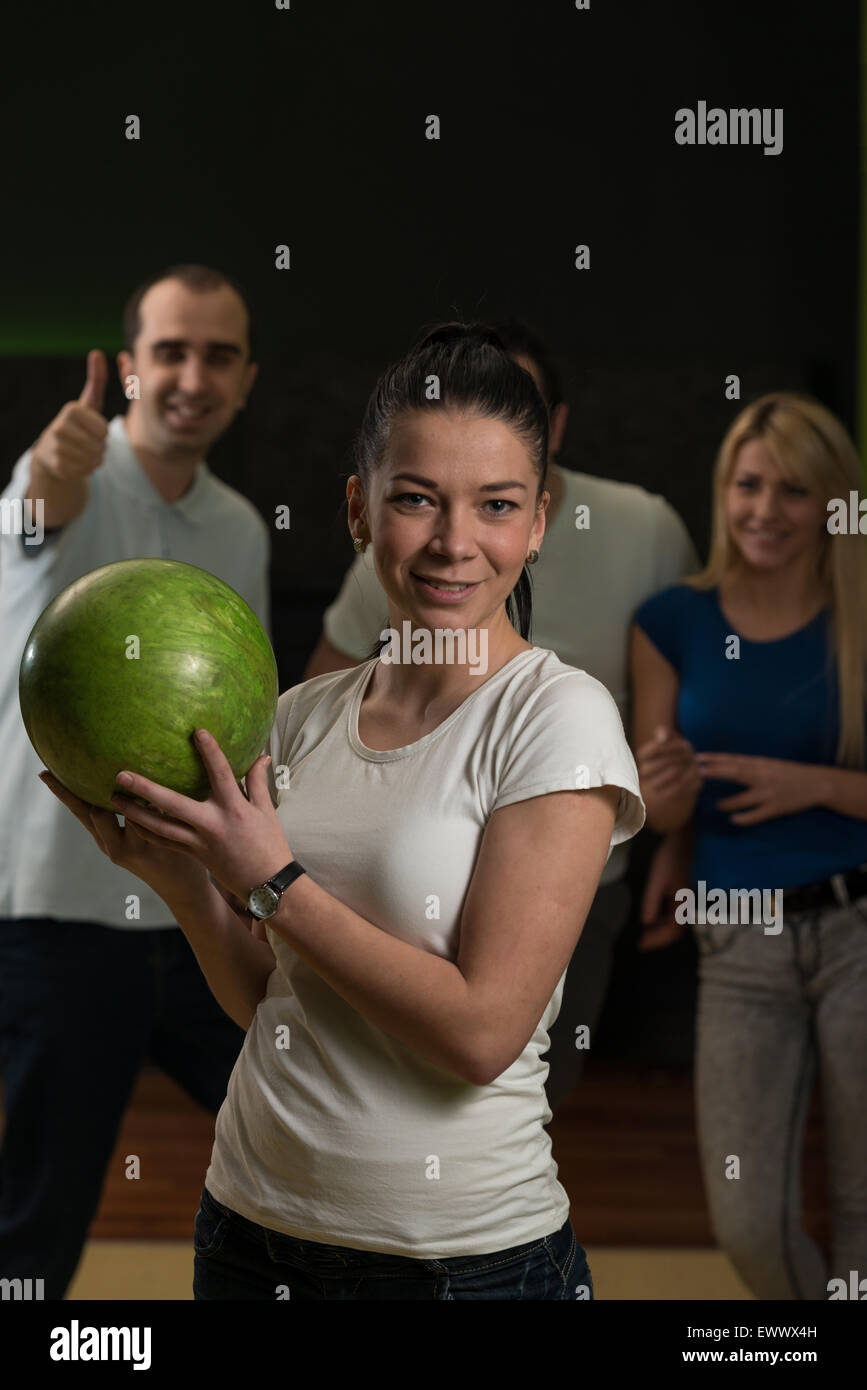 Friends Bowling Together Stock Photo - Alamy