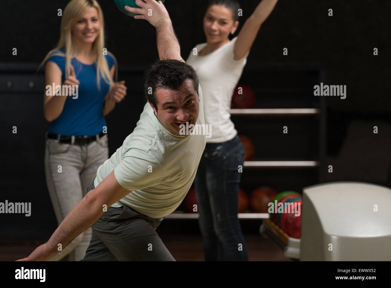 Three women at bowling alley hi-res stock photography and images - Alamy