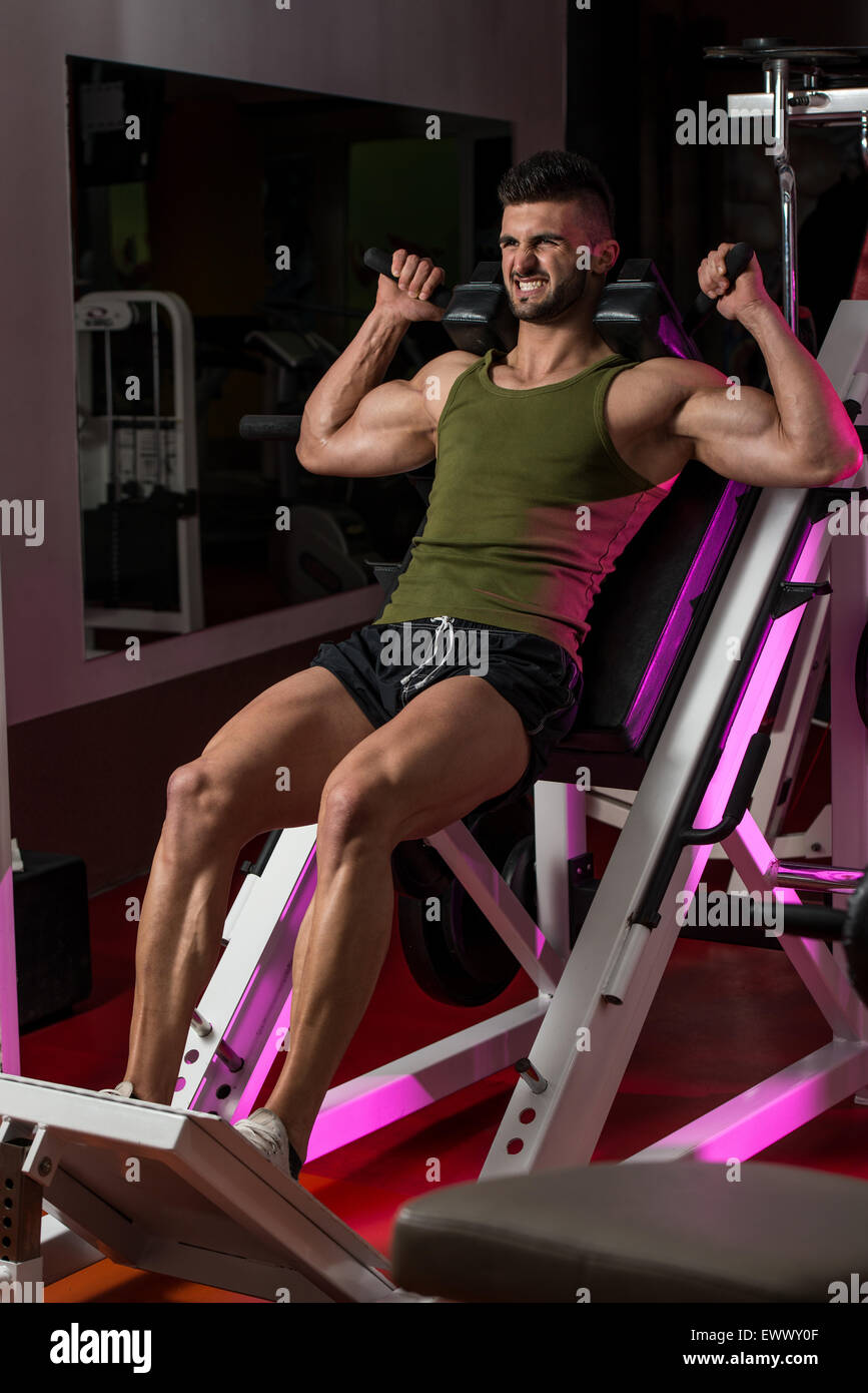 Young men leg press hi-res stock photography and images - Alamy